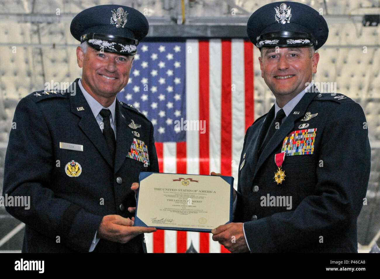 Lt. Gen. Samuel D. Cox, 18th Air Force commander, presents Col. John C ...