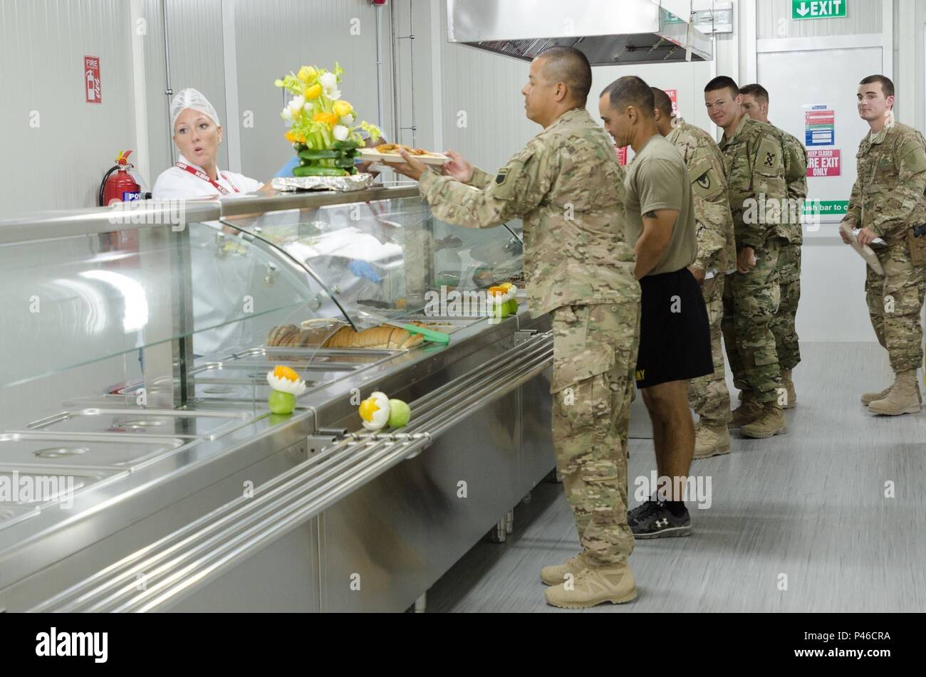 Service Members get the first plates of food served at a new dining ...