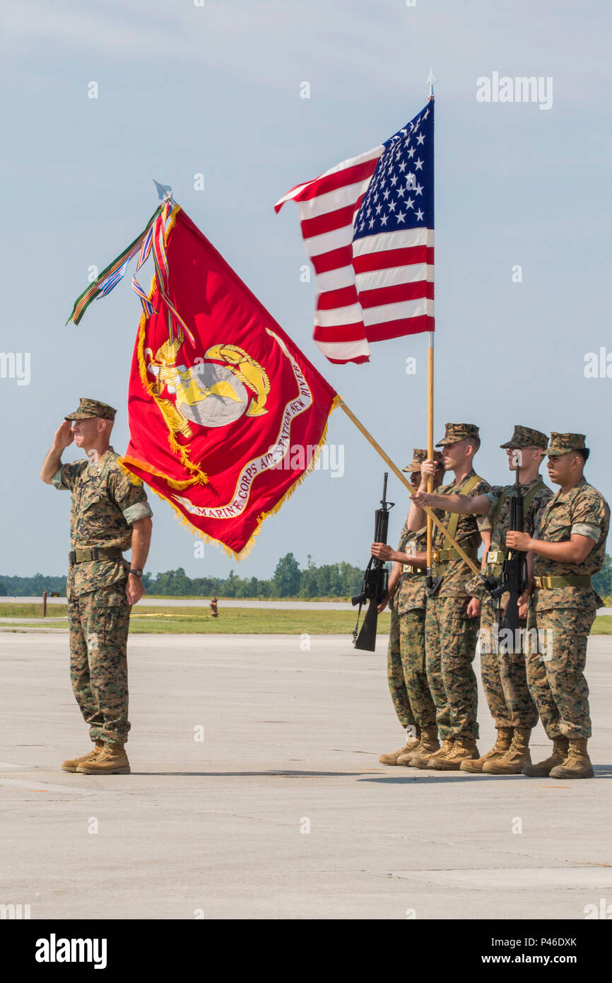 U.S. Marine Corps Col. Timothy M. Salmon (left), renders honors during ...