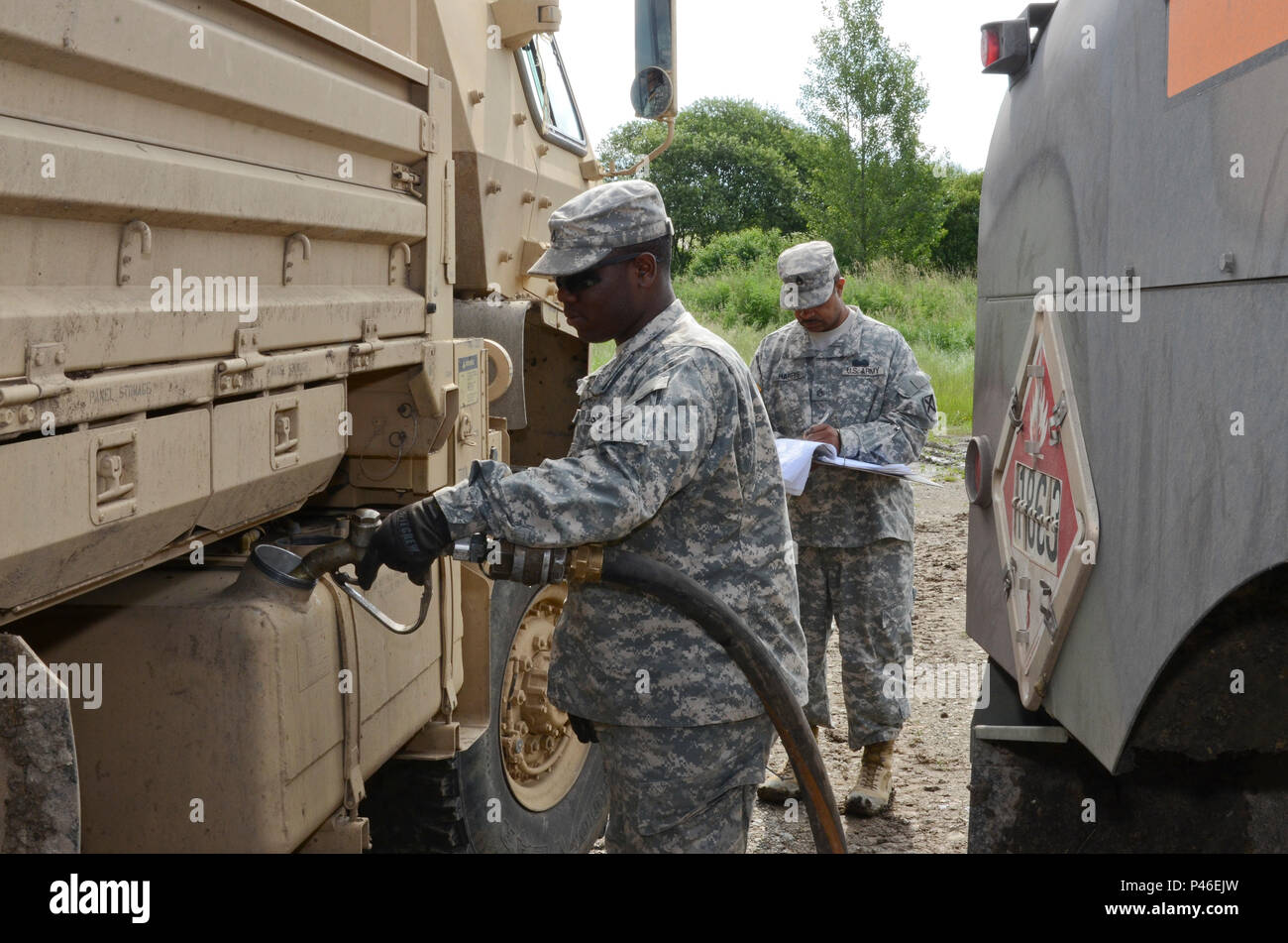 Pvt. 1st Class Dustin Ward (foreground), 877th Engineer Battalion ...