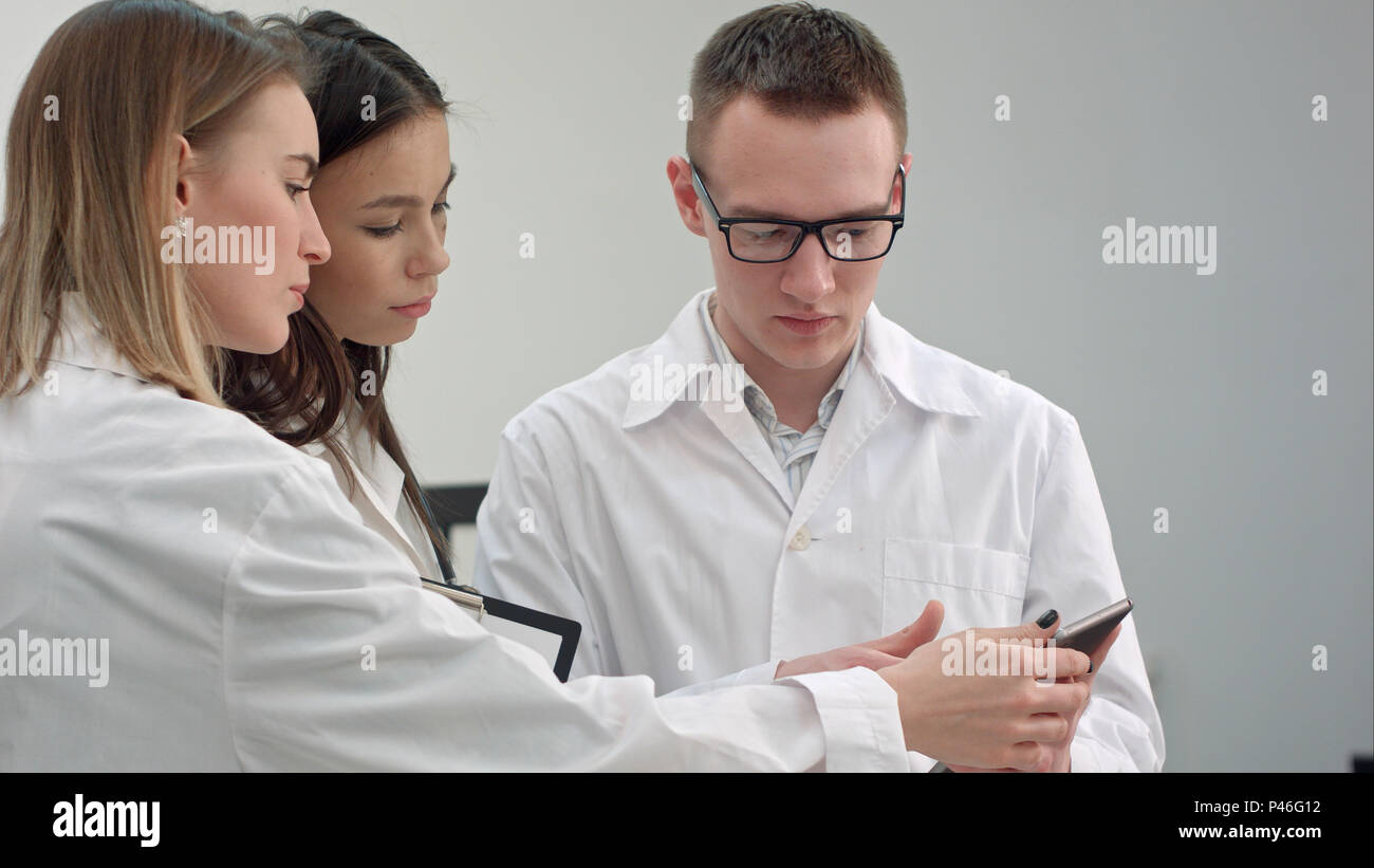 Doctor pointing something in hi-res stock photography and images - Alamy