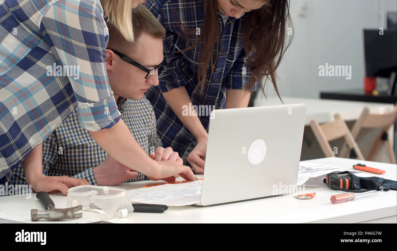 Young architects checking drawing measurements with divider Stock Photo ...