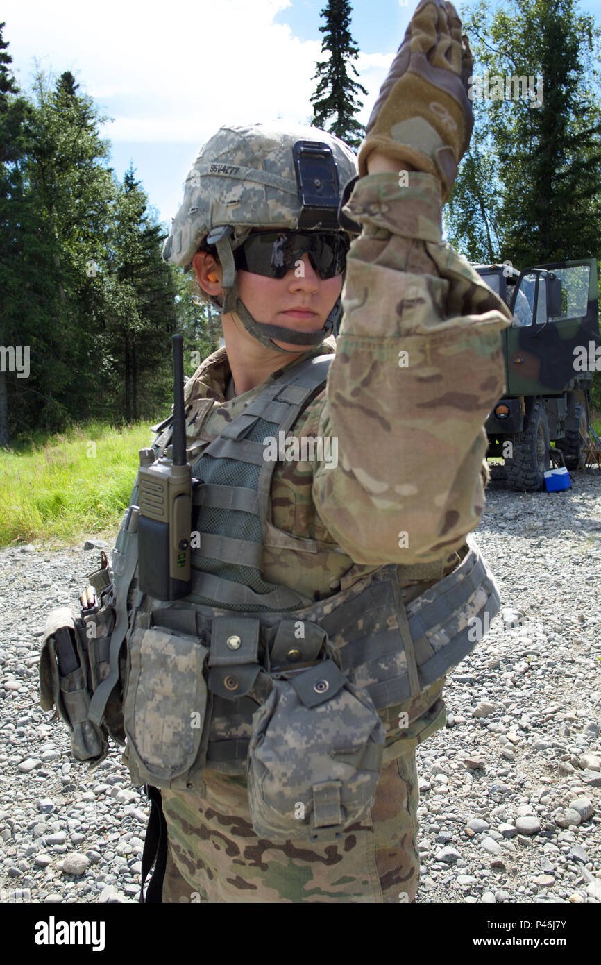 Sgt. Jessica Belcher, 95th Chemical Company, signals single-file ...