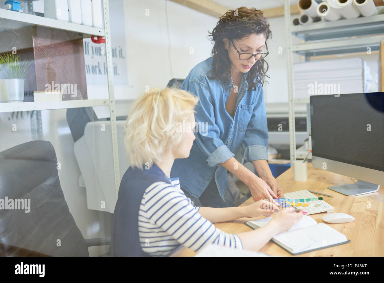 Graphic designers working together hi-res stock photography and images ...