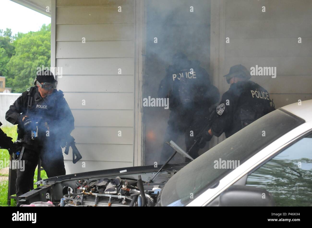Members of the Evansville, Ind., SWAT team entire a building during ...