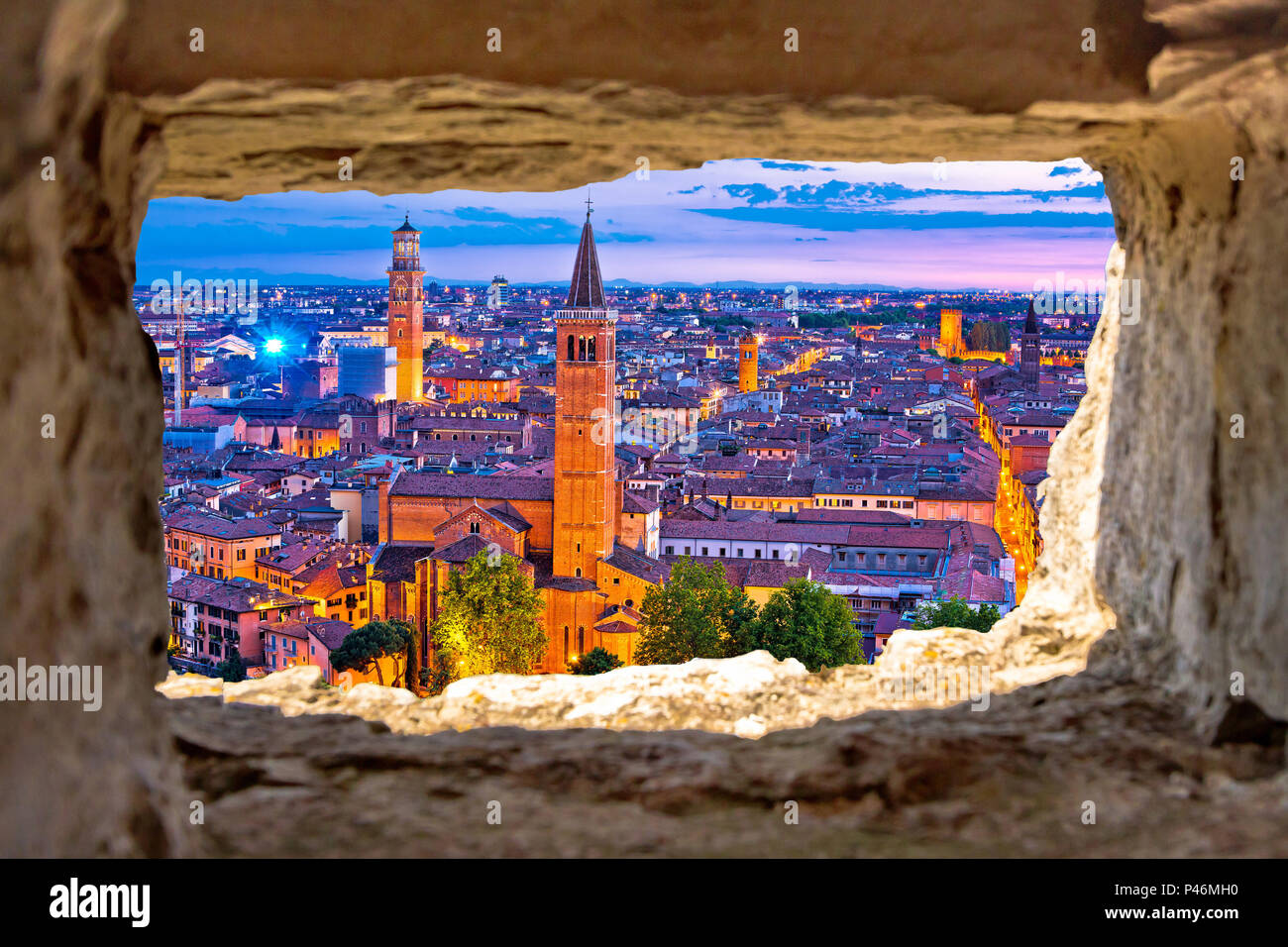 Verona historic skyline evening view through stone window, tourist ...