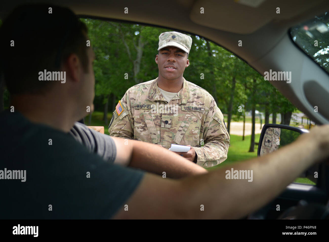 Spc. Darren Warfield from the Tennessee National Guard checks the ...
