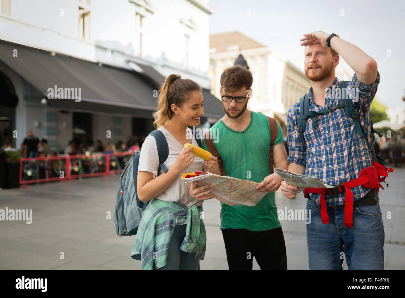 Young travelling people having fun in city Stock Photo - Alamy
