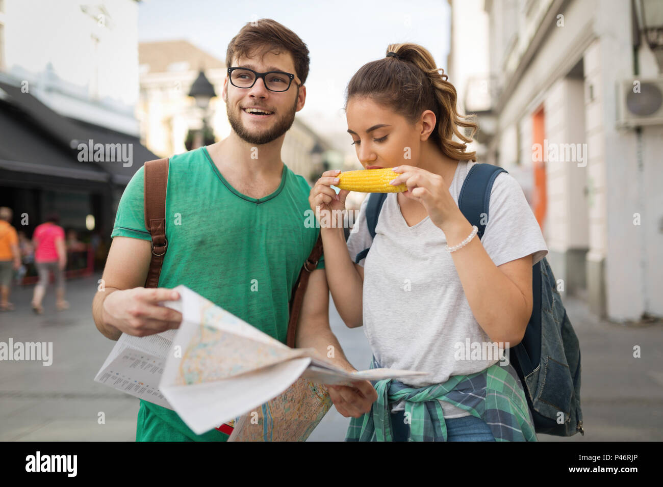 Young travelling people having fun in city Stock Photo - Alamy