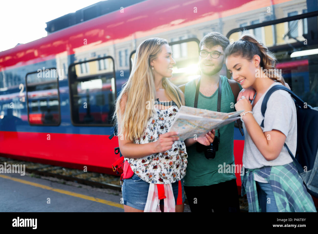 Group of friends traveling by train Stock Photo - Alamy