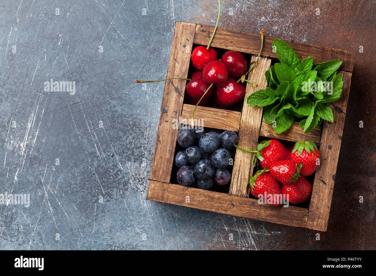 Fresh summer berries box. Cherry, blueberry, strawberry and mint. Top ...