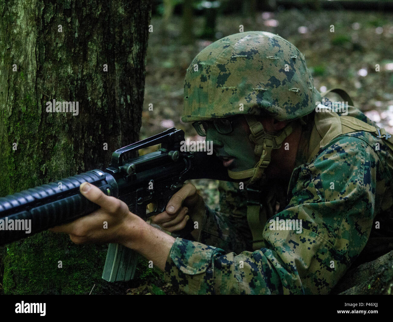 A candidate with Alpha Company, Officer Candidate School, conducts the ...