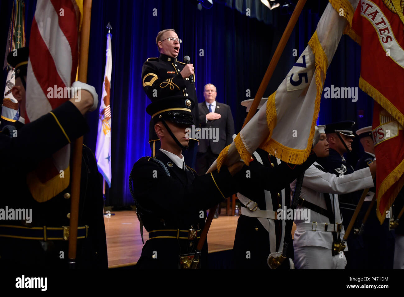 Army vocalist sings the national anthem during the 4th Estate ...