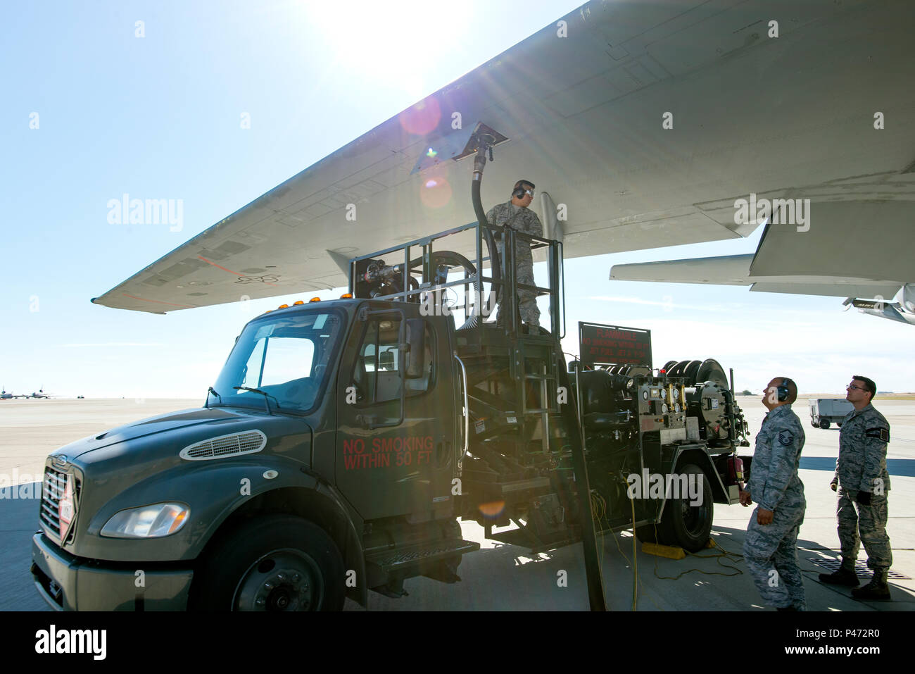 Airmen conduct a fuel transition between a R-12 Refueler Mobility Unit ...