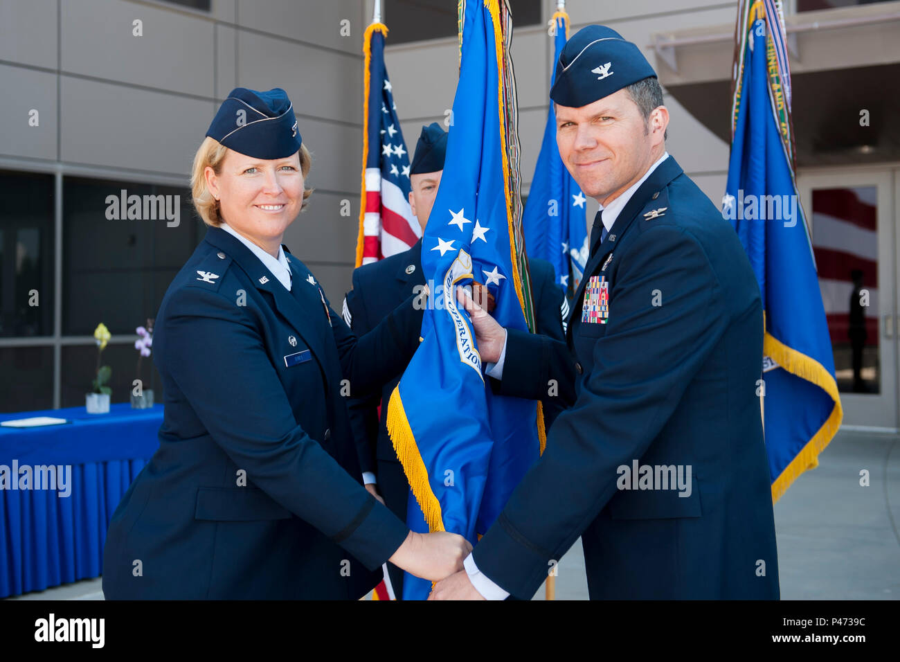 Col. DeAnna Burt, 50th Space Wing commander, presents the guidon to Col ...