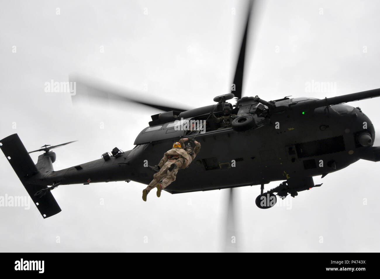 A pararescueman from the 304th Rescue Squadron, Portland Air National Guard Base, Ore., and a ...