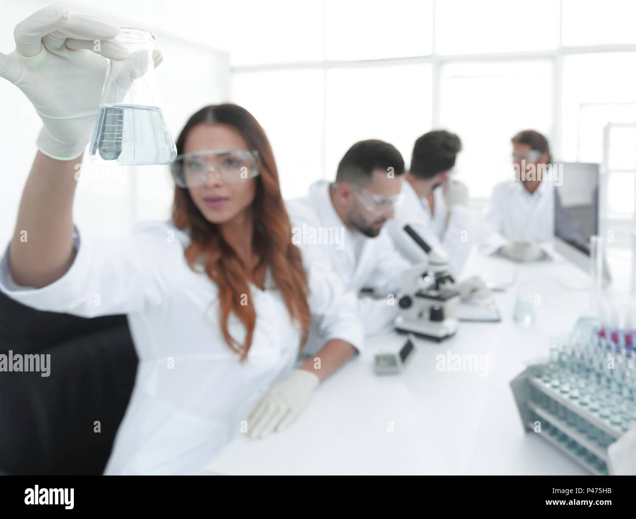 group of young scientists working in the laboratory Stock Photo - Alamy