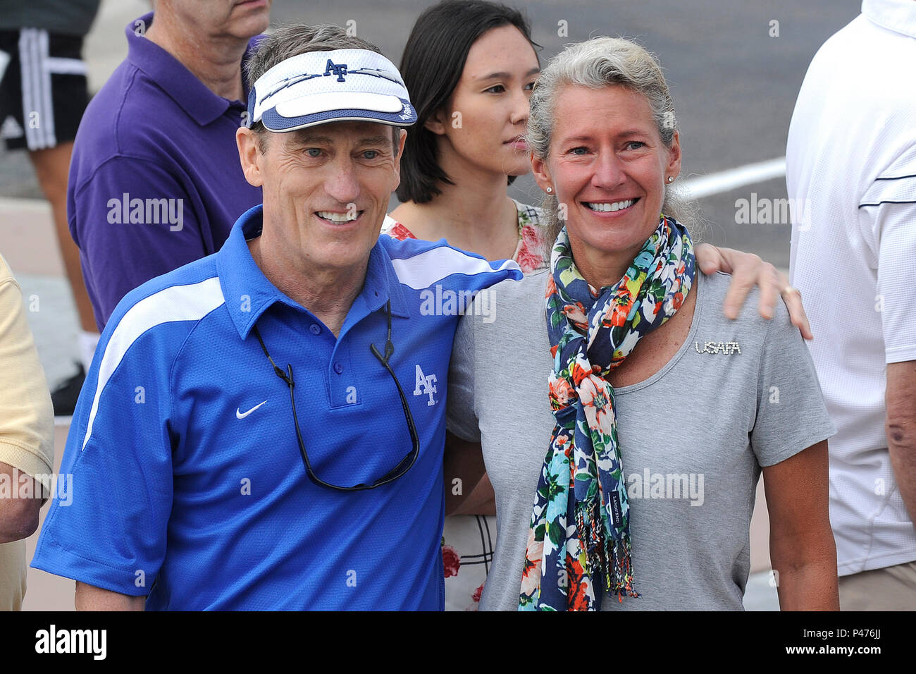 Tim and Dana Born watch their daughter, basic cadet Hanna Born, depart ...