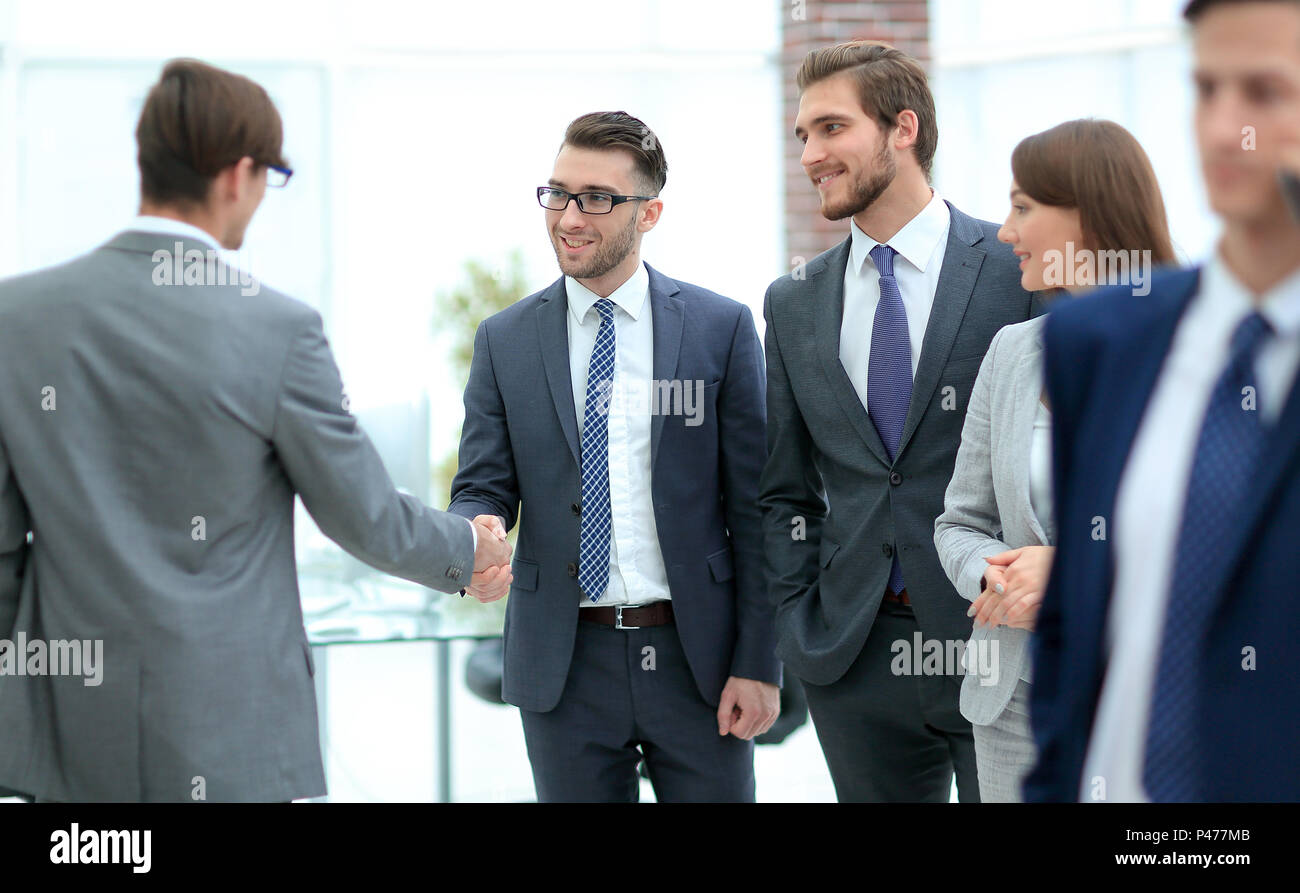 Confident young people, handshake and smile Stock Photo - Alamy