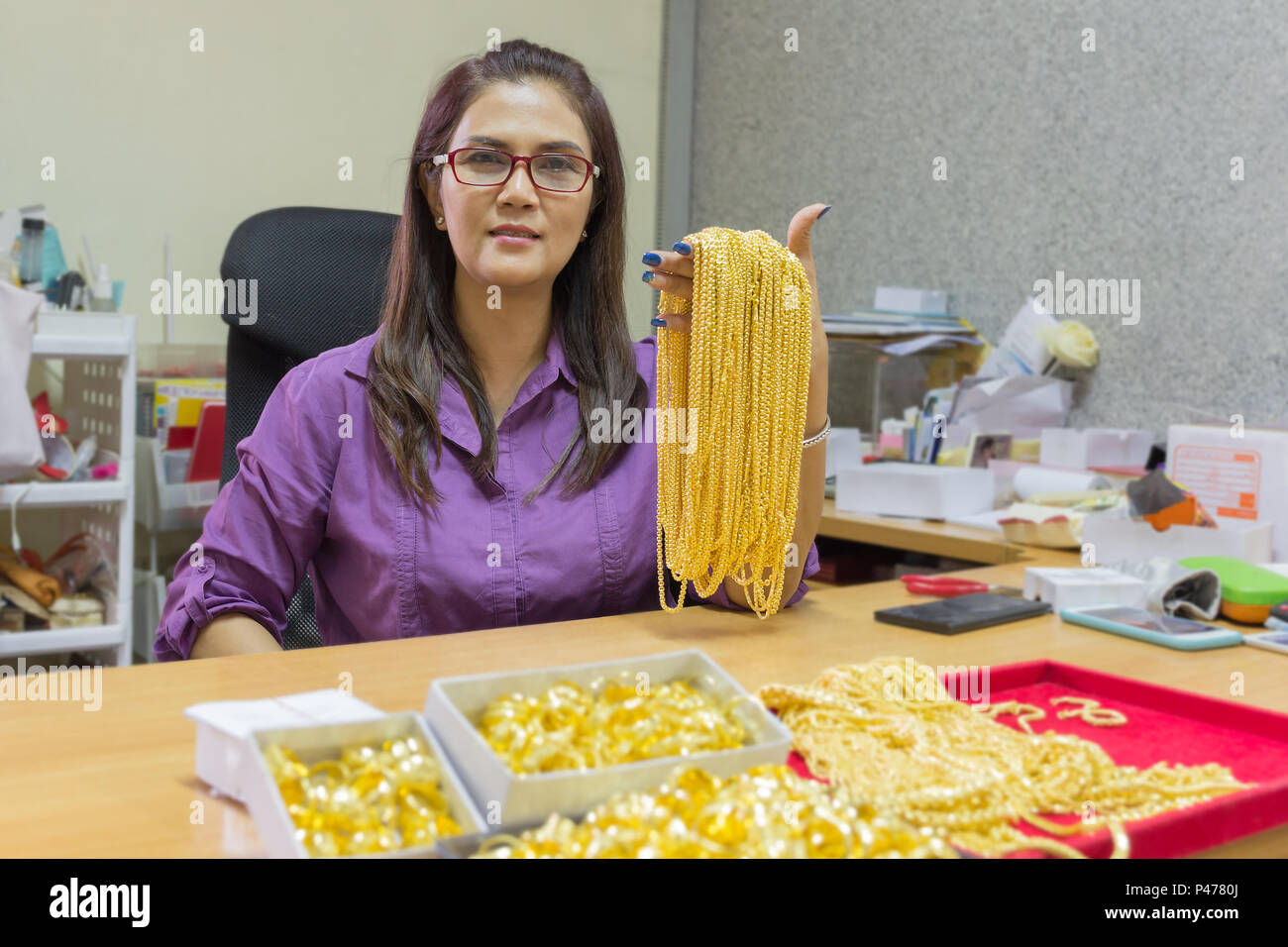 Gold ingot woman hi-res stock photography and images - Alamy