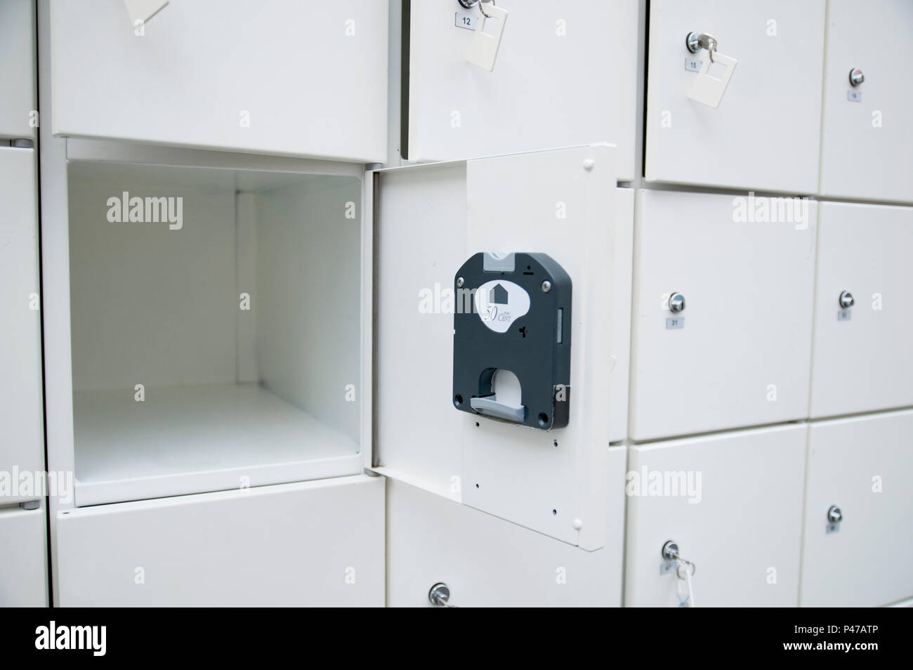 white locker locker. open the door. safe deposit box Stock Photo - Alamy