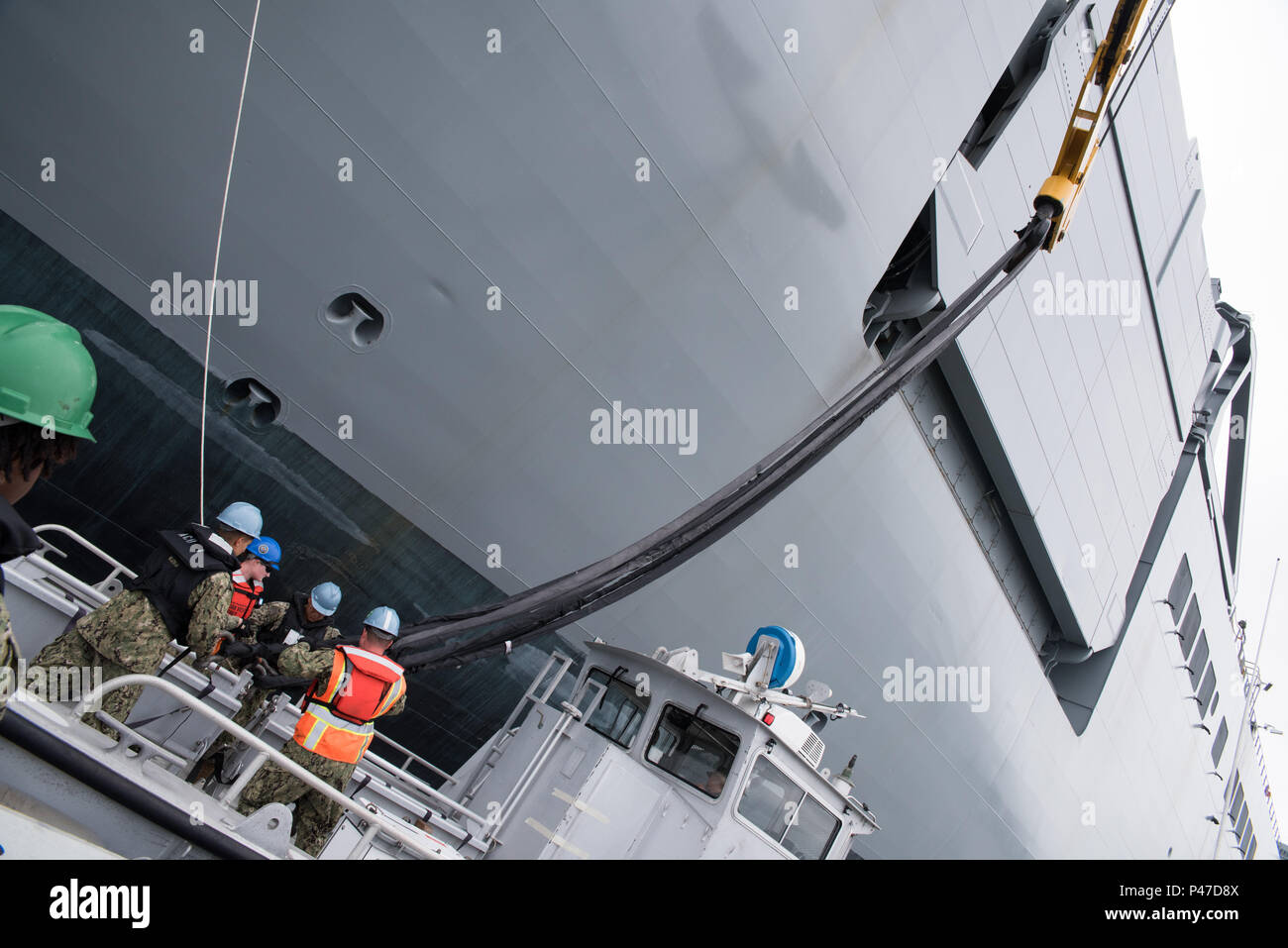 Sailors, attached to Naval Cargo Handling Battalion 1 and Assault Craft ...