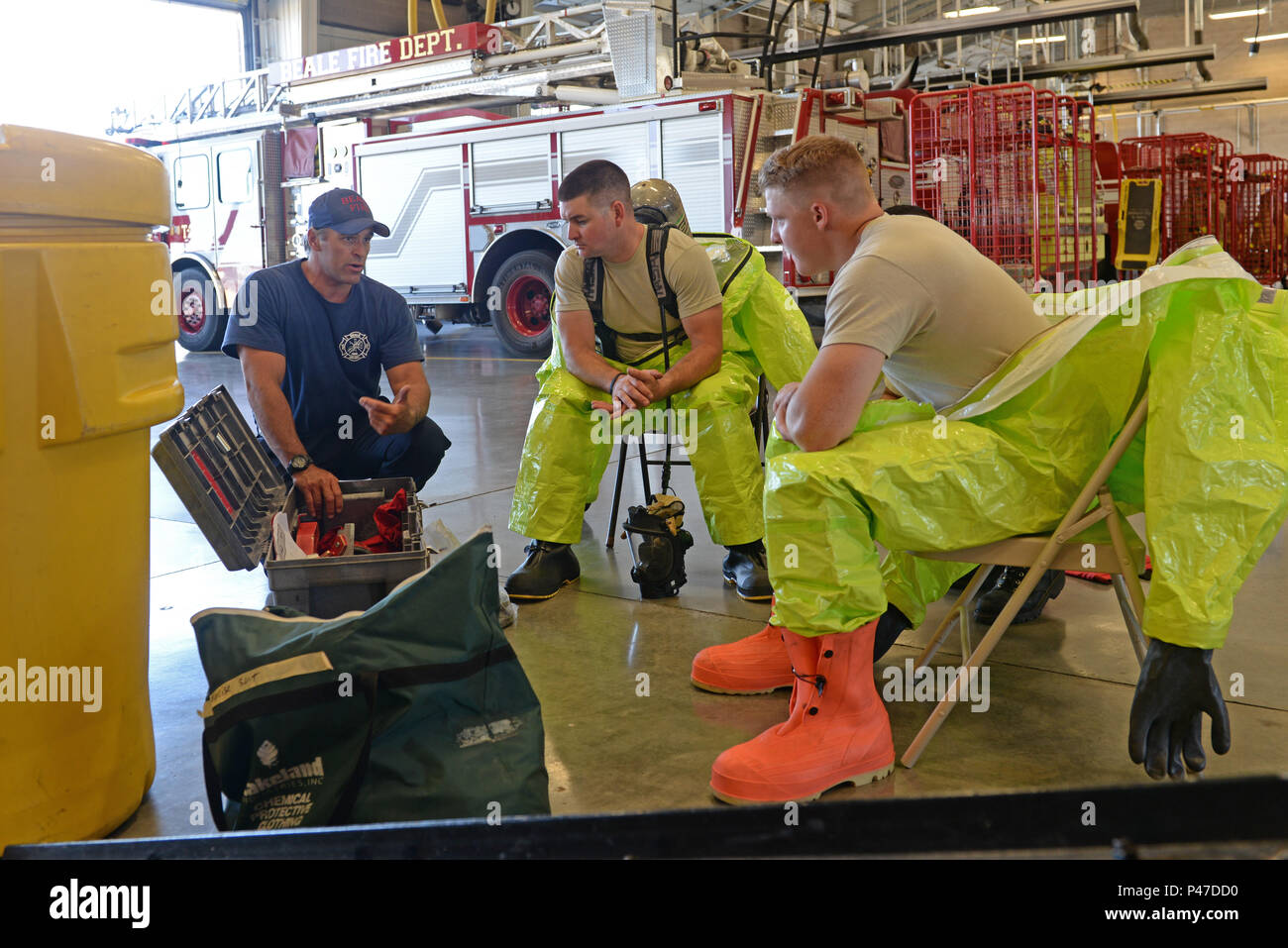 Brian Atkins (left), 9th Civil Engineer Squadron (CES) fire captain ...