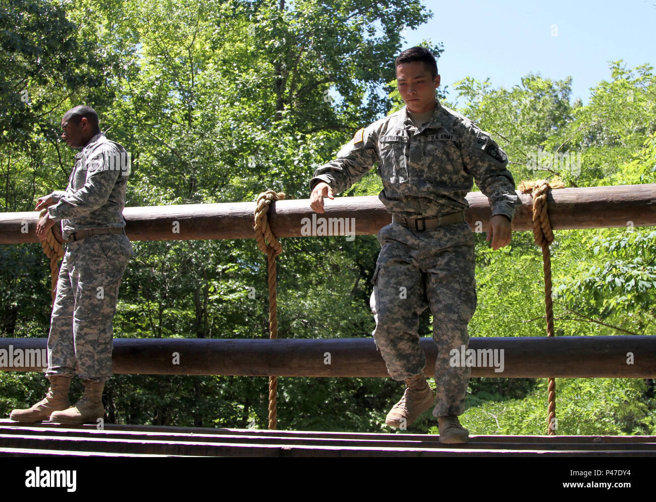 Task Force Wolf instructor from the 2nd of the 399th Training Support Battalion (ROTC) coaches a ...