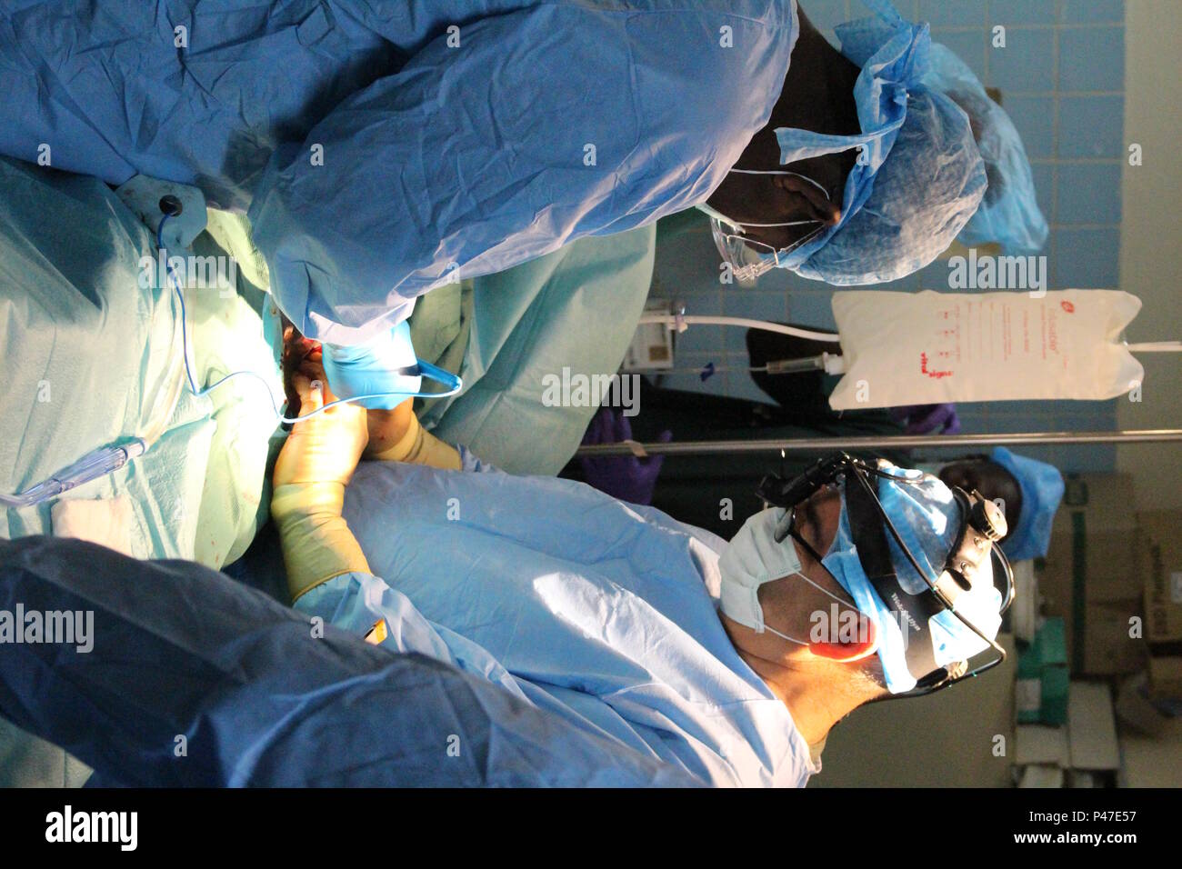 U.S. Army Reserve Col. Ali Zaza, right, assists a Chadian surgeon as ...