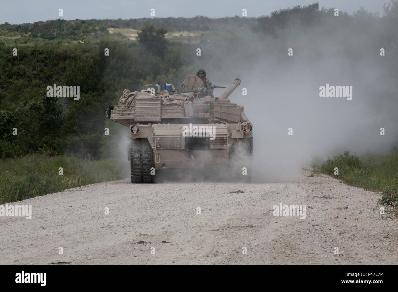 An M1A2 Abrams tank crew from Company B, 3rd Battalion, 8th Cavalry ...