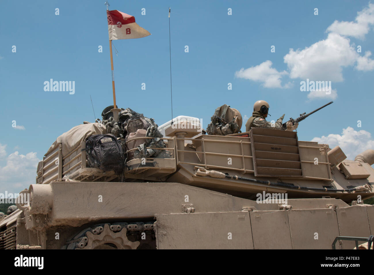 An M1A2 Abrams tank crew from Company B, 3rd Battalion, 8th Cavalry ...