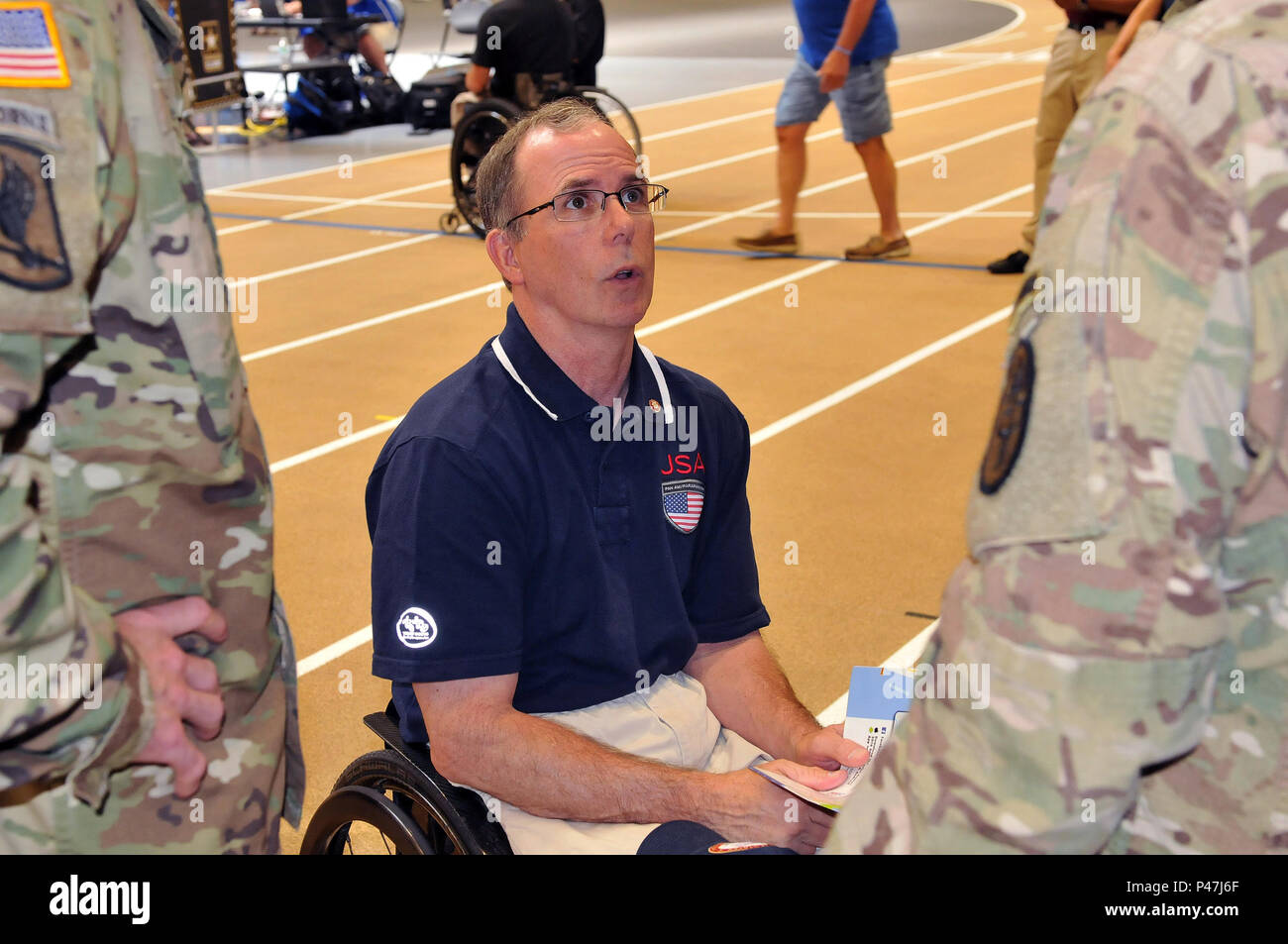 Dr. Rory Cooper talks to Soldiers at the Archery competition at the ...