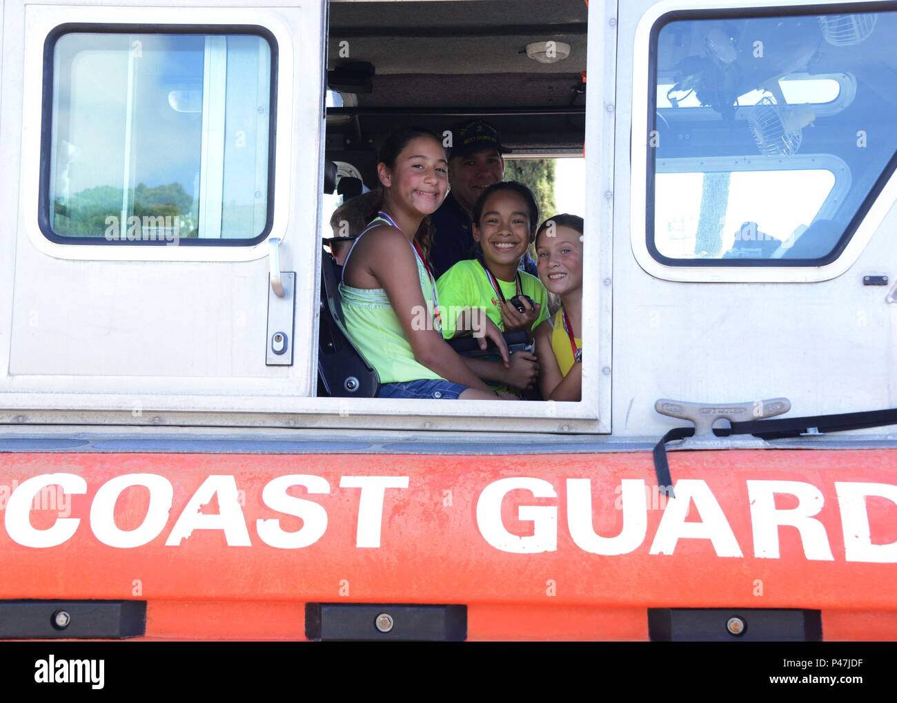 Students pose inside a Coast Guard 25-foot Response Boat-Small during ...
