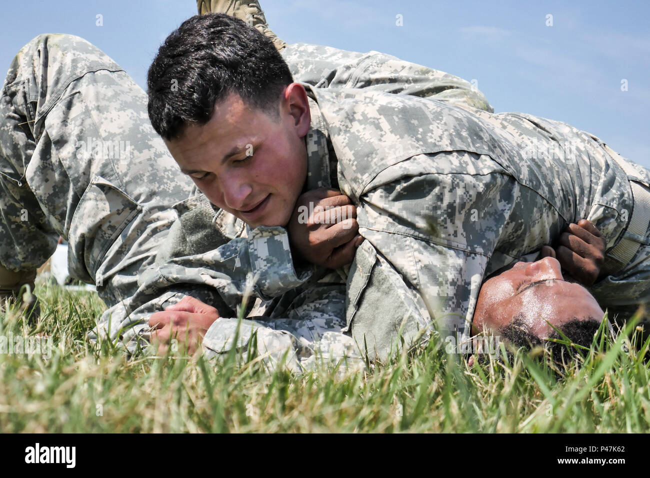 U.S. army Spc Kyle O'Day (top), assigned to the 760th Ordinance Company ...