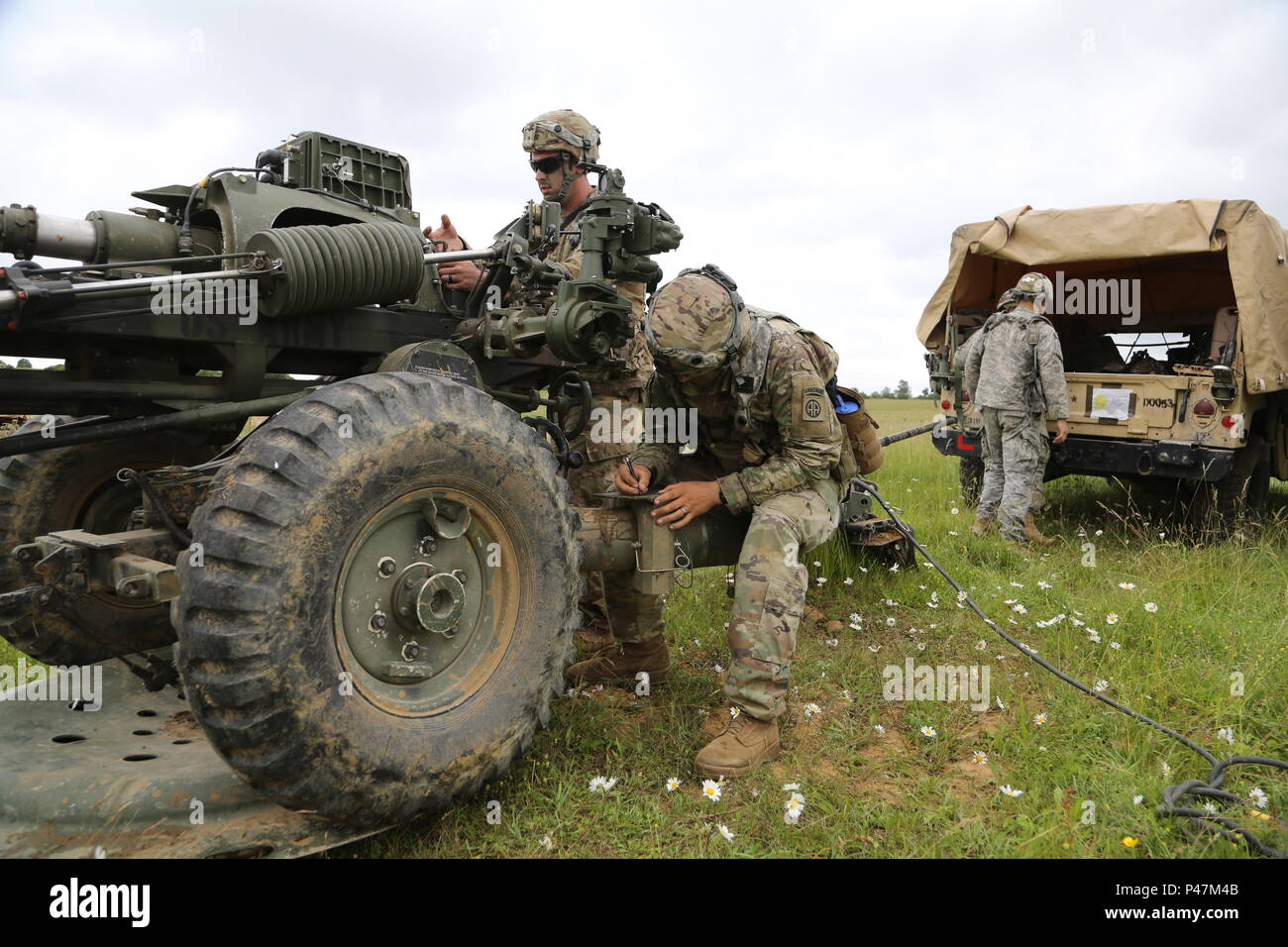 U.S. Soldiers of the 3rd Battalion, 319th Airborne Field Artillery Regiment prepare M119A3 ...