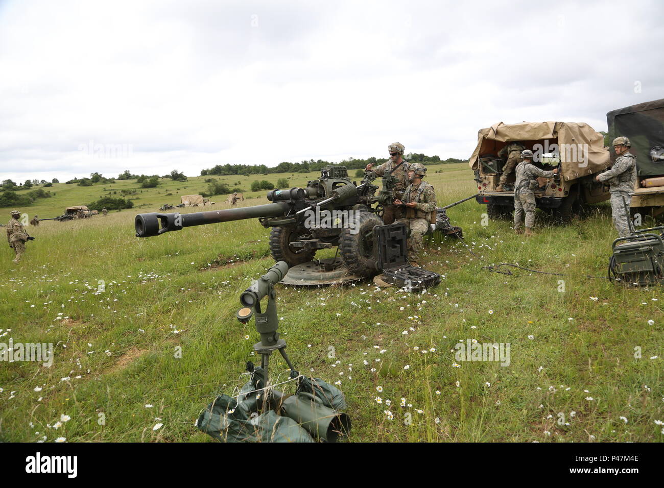 U.S. Soldiers of the 3rd Battalion, 319th Airborne Field Artillery Regiment prepare M119A3 ...