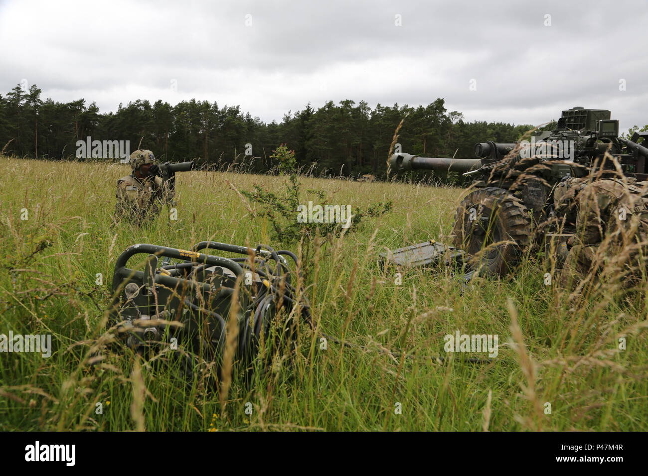 U.S. Soldiers of the 3rd Battalion, 319th Airborne Field Artillery Regiment prepare M119A3 ...