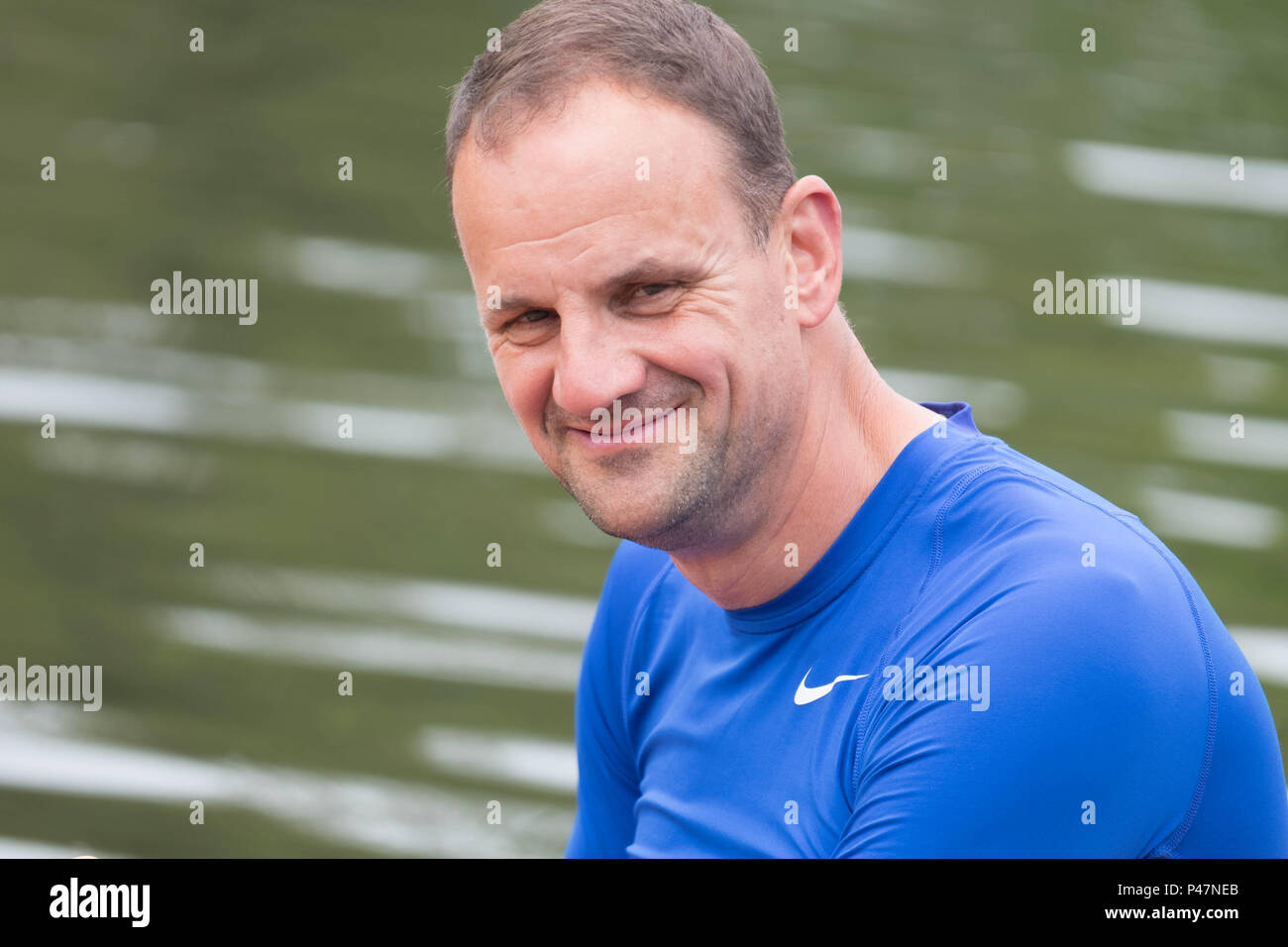 man in blue sports cloths Stock Photo - Alamy