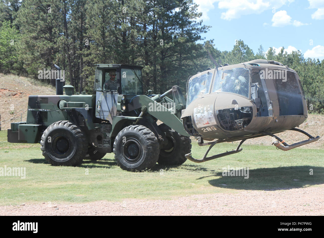 South Dakota Army National Guard Soldier pick up a training helicopter ...