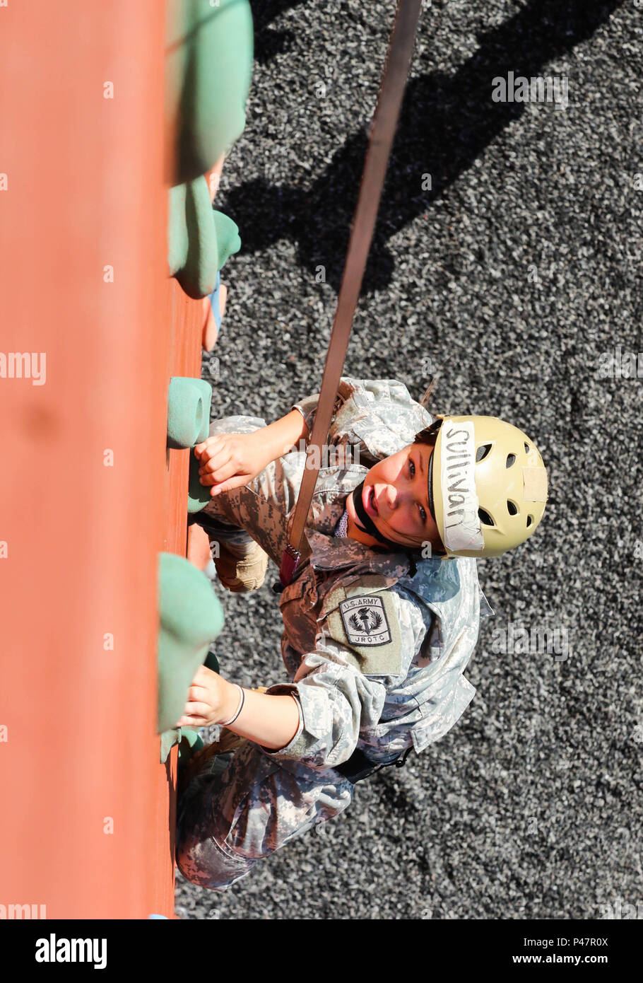 FORT HOOD, Texas - A cadet climbs a 60 foot wall as one of the ...