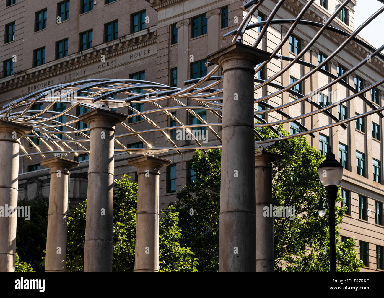 The Neoclassical County Building is seen through the pergola by artist ...