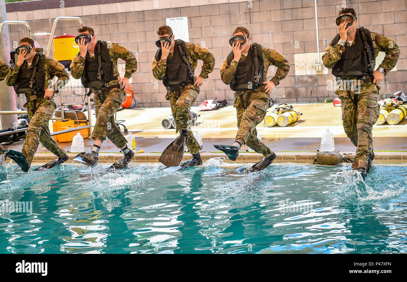 Special Tactics Training Squadron students jump into the pool in scuba ...