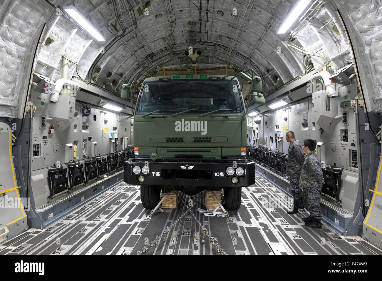 Japan Air Self-Defense Force members watch their electric power plant ...