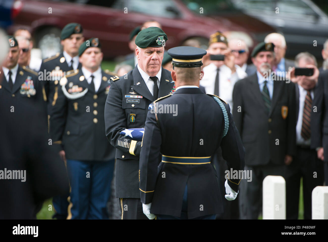 Lt. Gen. John F. Mulholland Jr., center left, receives the American ...