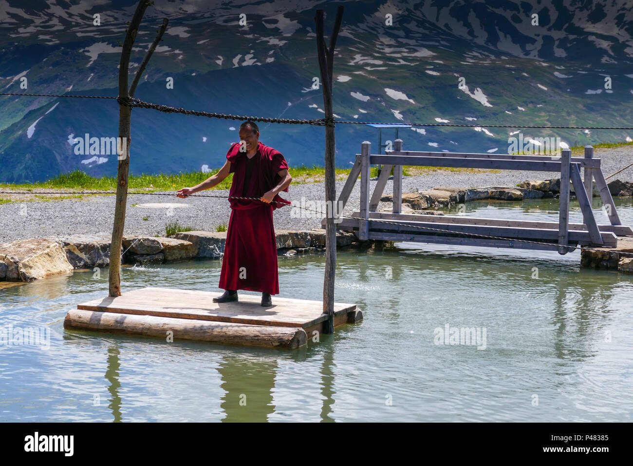 Tibetan Buddhist monks in red robes, in Switzerland, playing on ...