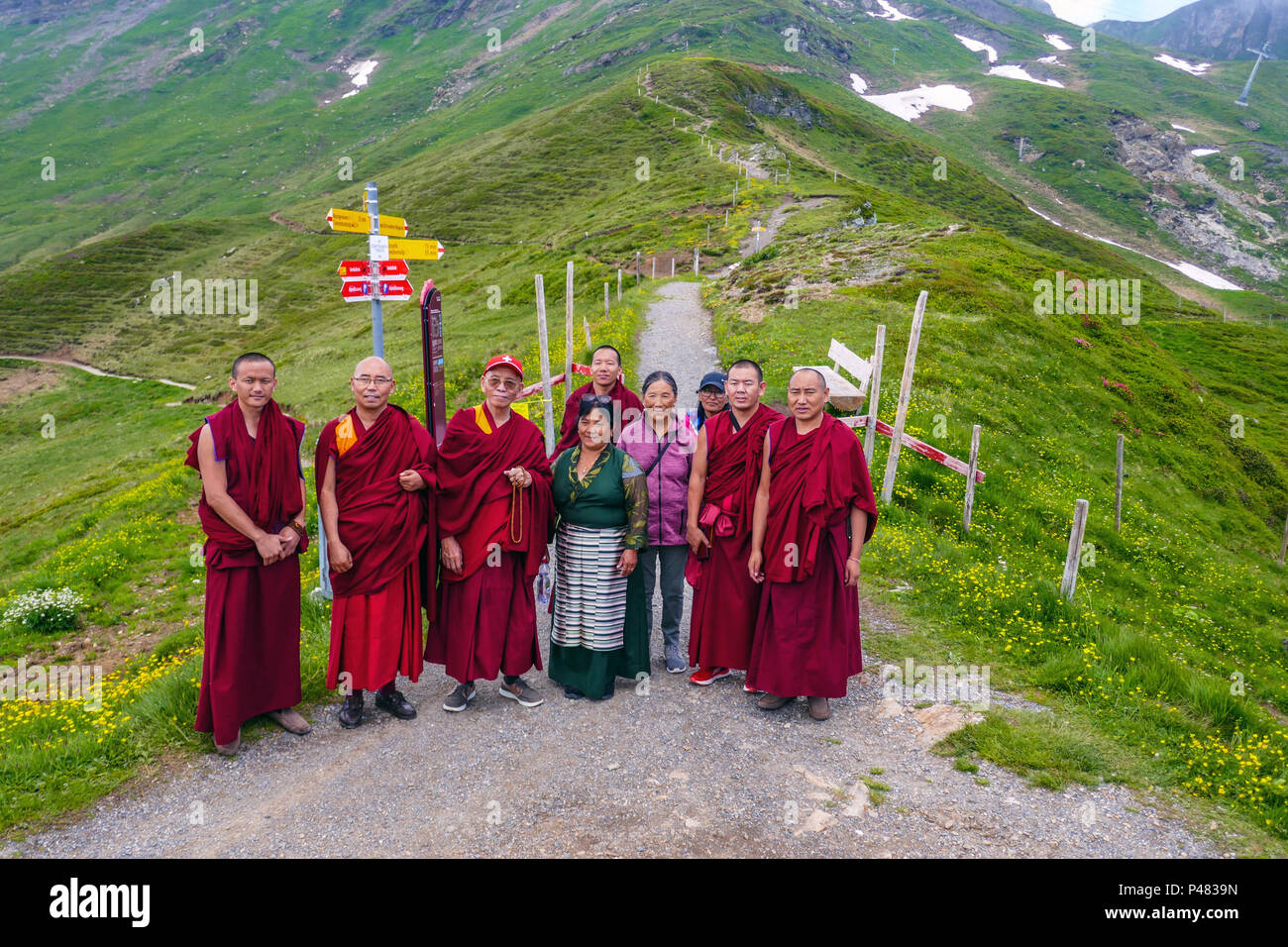 Tibetan Buddhist monks in red robes, in Switzerland Stock Photo - Alamy