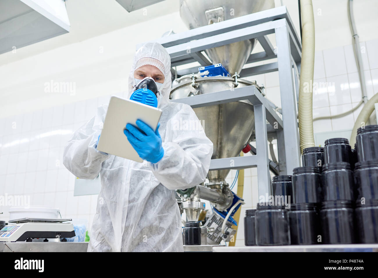 Factory worker in white uniform hi-res stock photography and images - Alamy