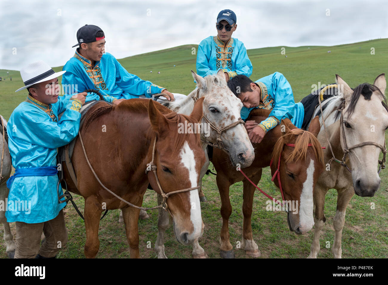 Young horsemen hang out with horses at Zhenglanqi Wuyi Farm, Inner ...