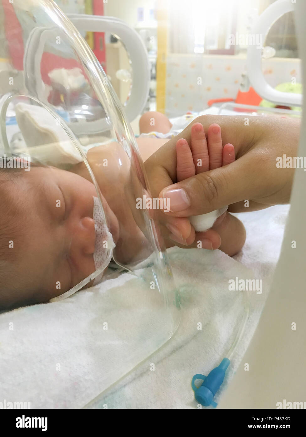 Patient new born baby in incubator at hospital Stock Photo - Alamy