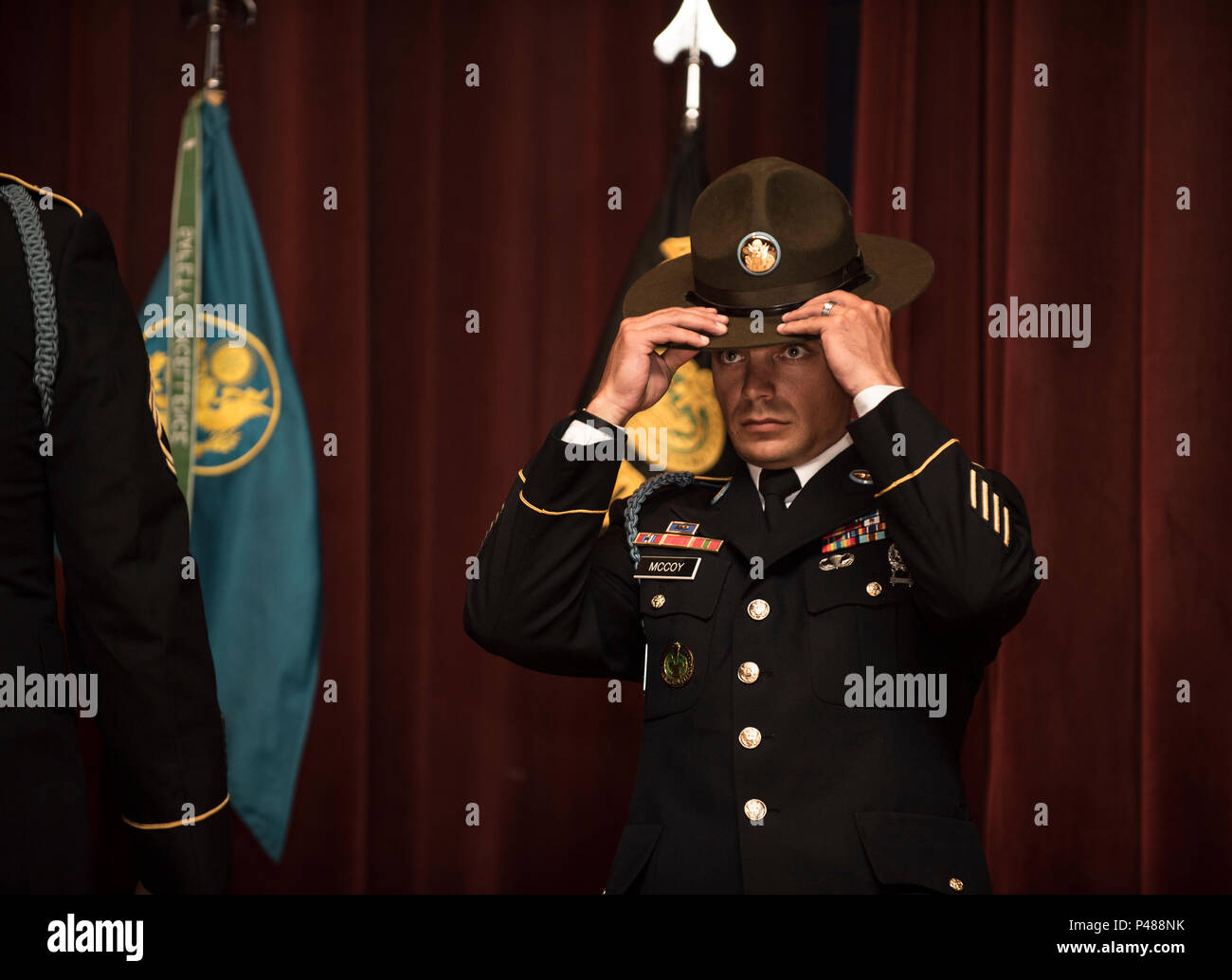 Graduates of the Drill Sergeant Course are each presented with their ...